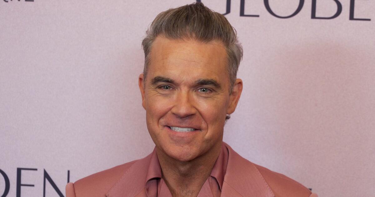 Robbie Williams zeigt seine neuen Zähne - Video | 1&1